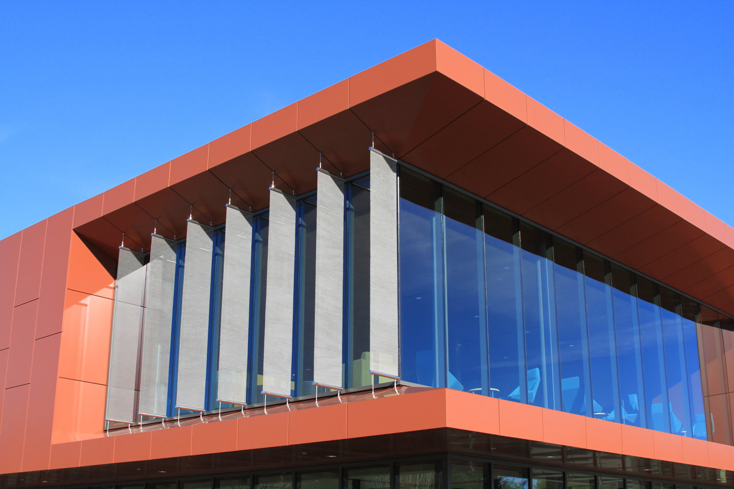 Coiled Wire Fabric Provides Solar Shading with an “Aged” Aesthetic