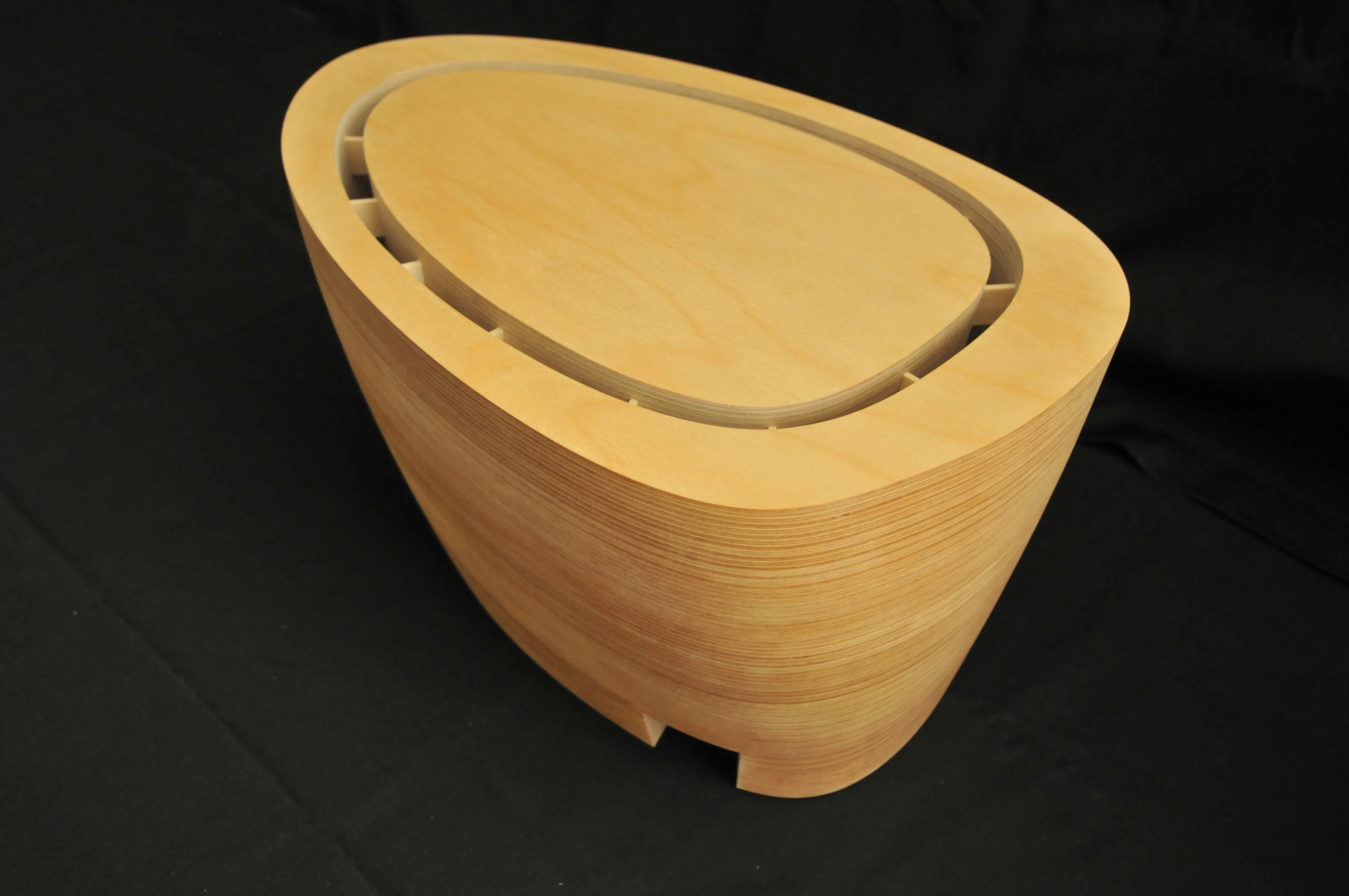 A Curved Wooden Chapel in a Northern Square