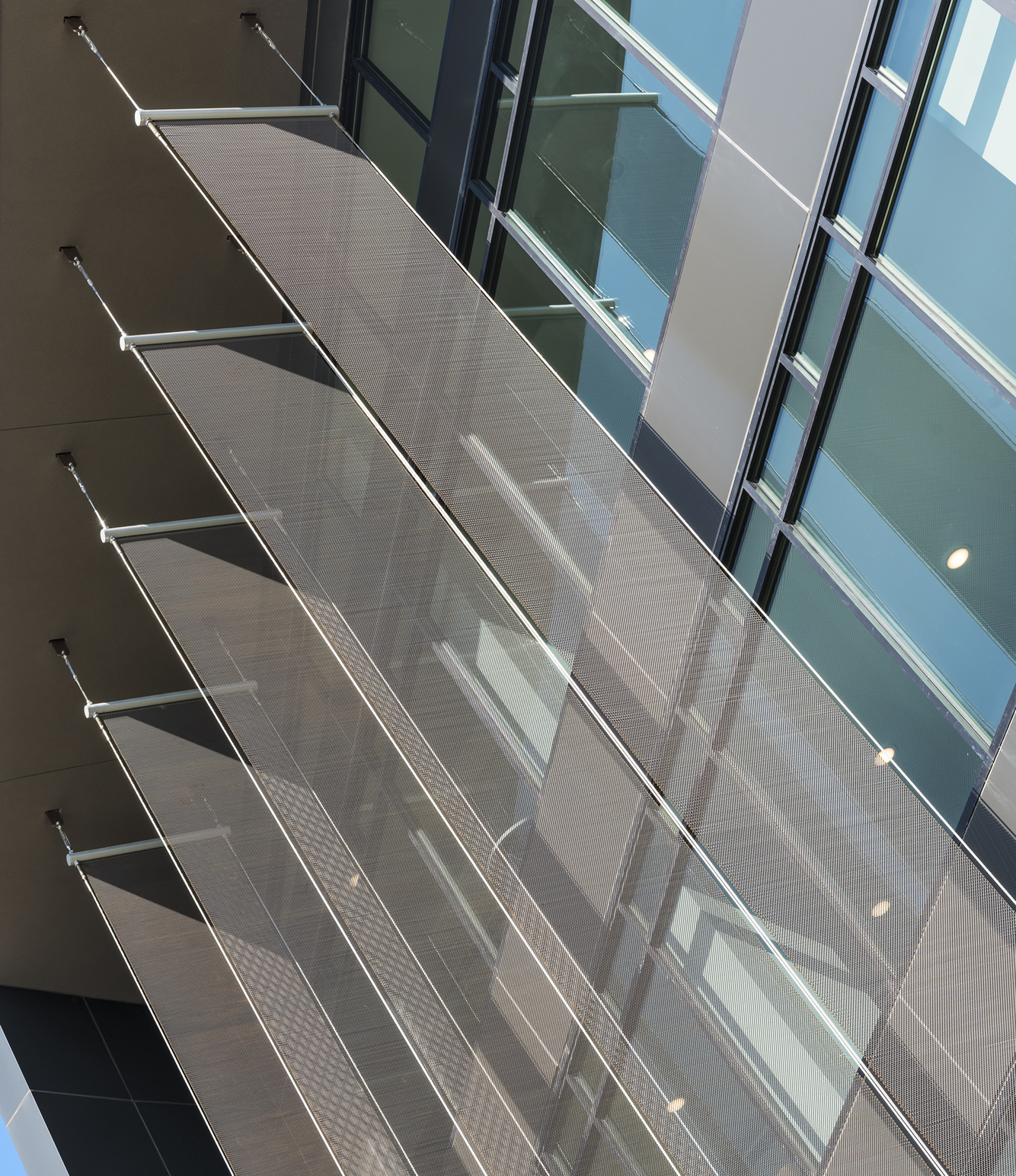 Coiled Wire Fabric Provides Solar Shading with an “Aged” Aesthetic